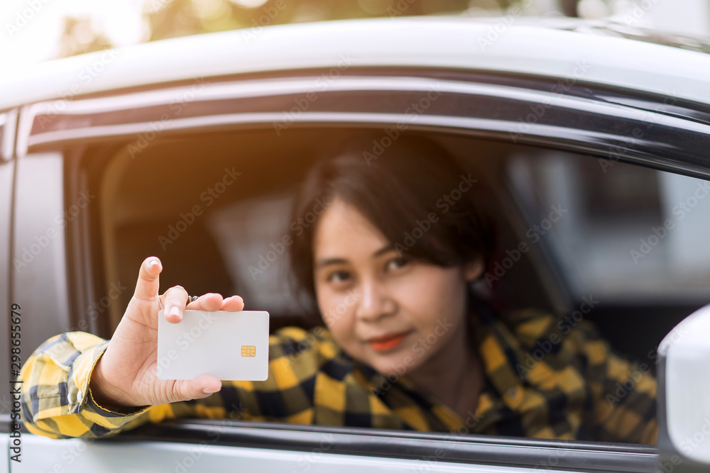 young happy Asian woman showing new driver license or blank white ...