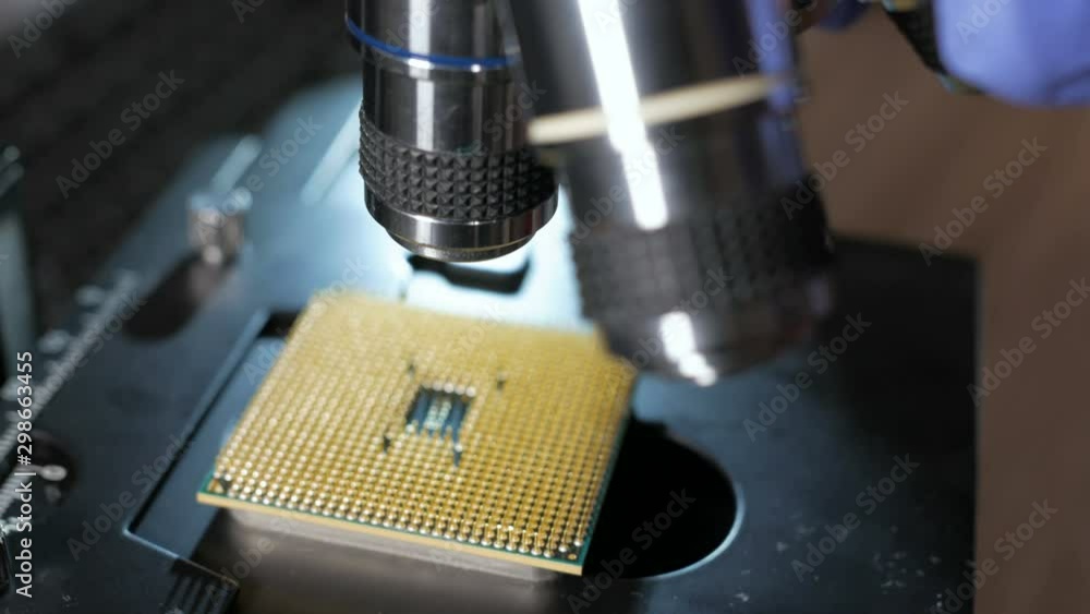 Processor is being examined for apparent defects under microscope. In ...