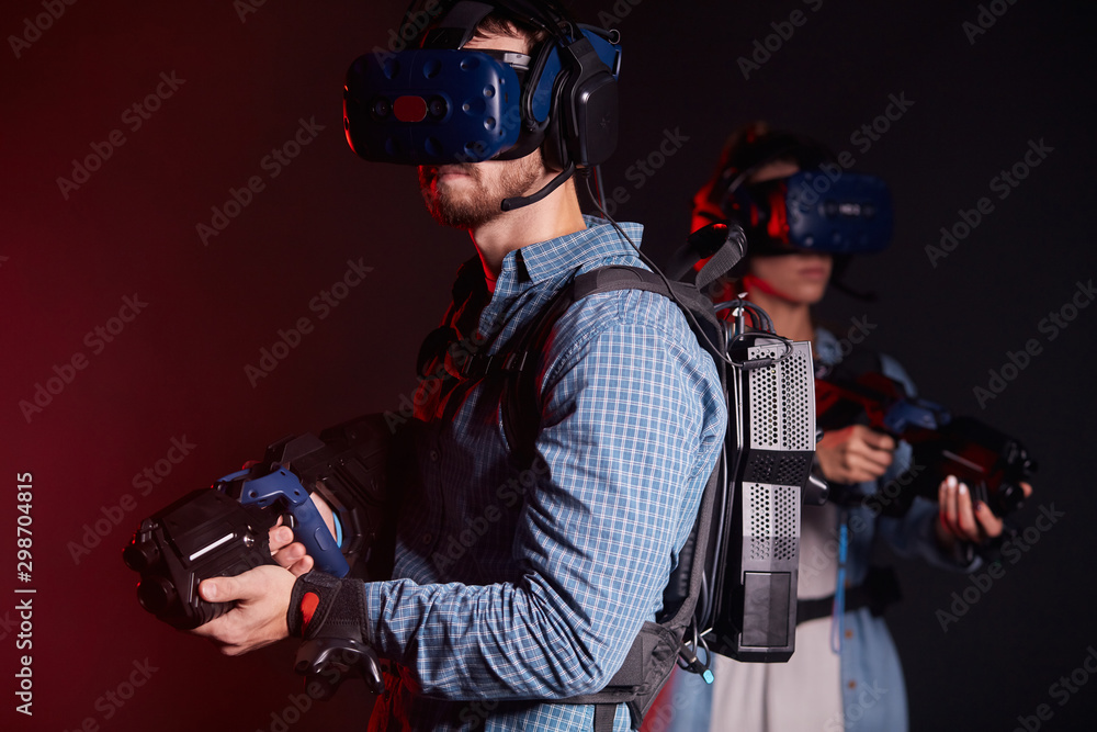Lovely couple playing vr game as team, fighting. Wearing casial clothes ...
