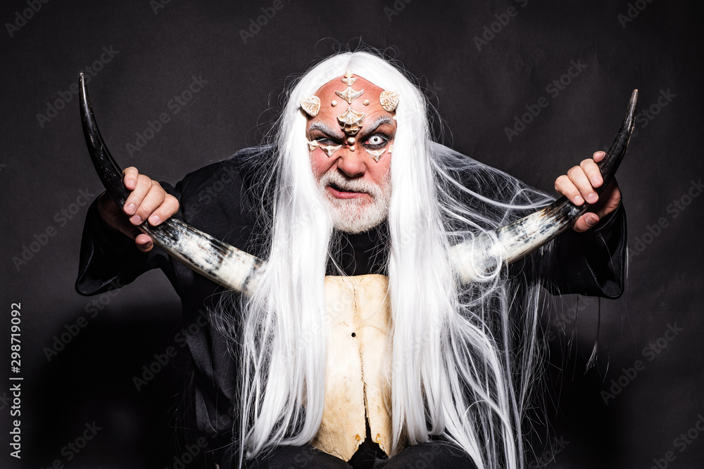 Monster with sharp thorns and warts on face. Man with a bull head ...