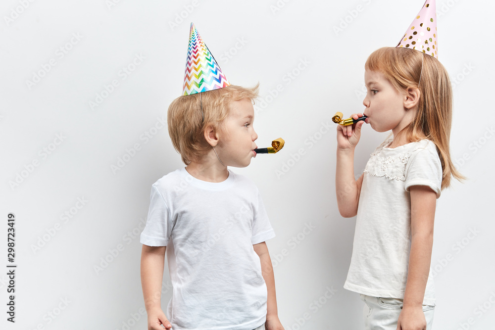 attractive kids celebrating birthday, positive feeling and emotion ...