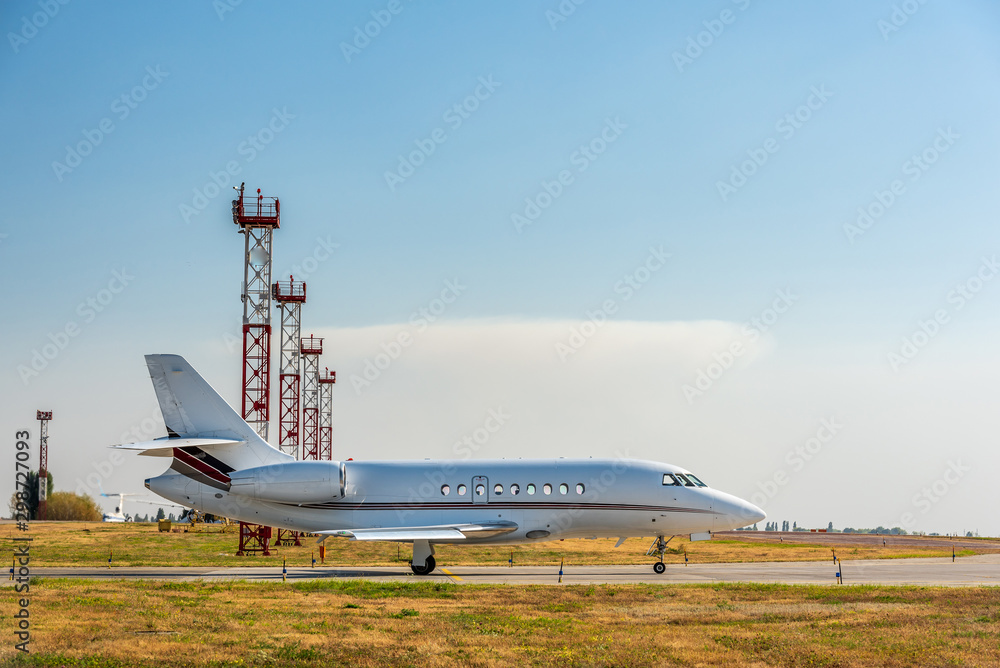 Business private jet airplane on airfield. Preparing for take-off ...