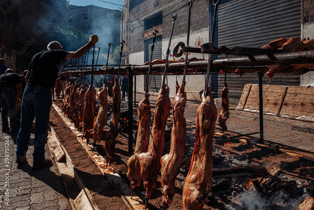 ORGOSOLO, SARDINIA /OCTOBER 2019: The old tradition of cooking the ...