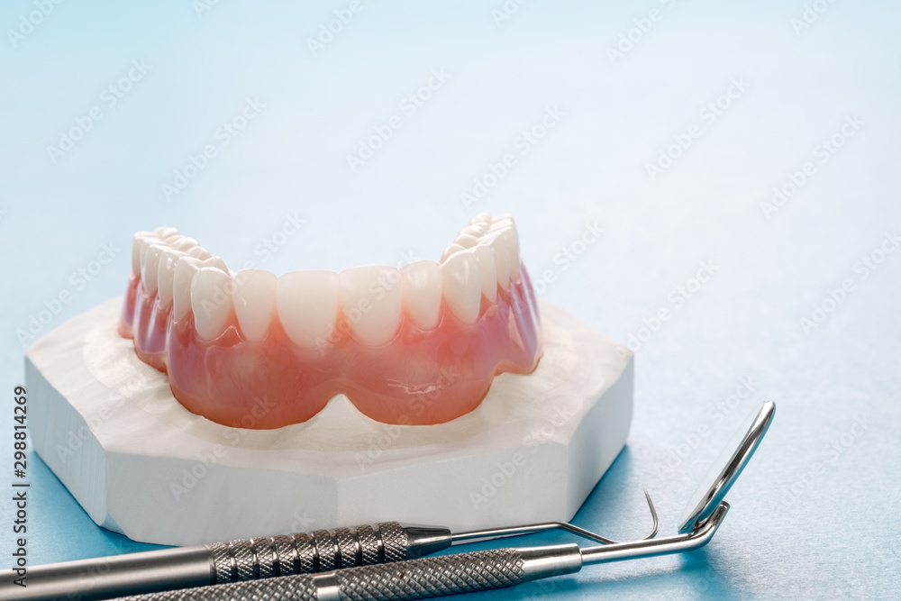 Close up , Complete denture or full denture on blue background. Stock ...