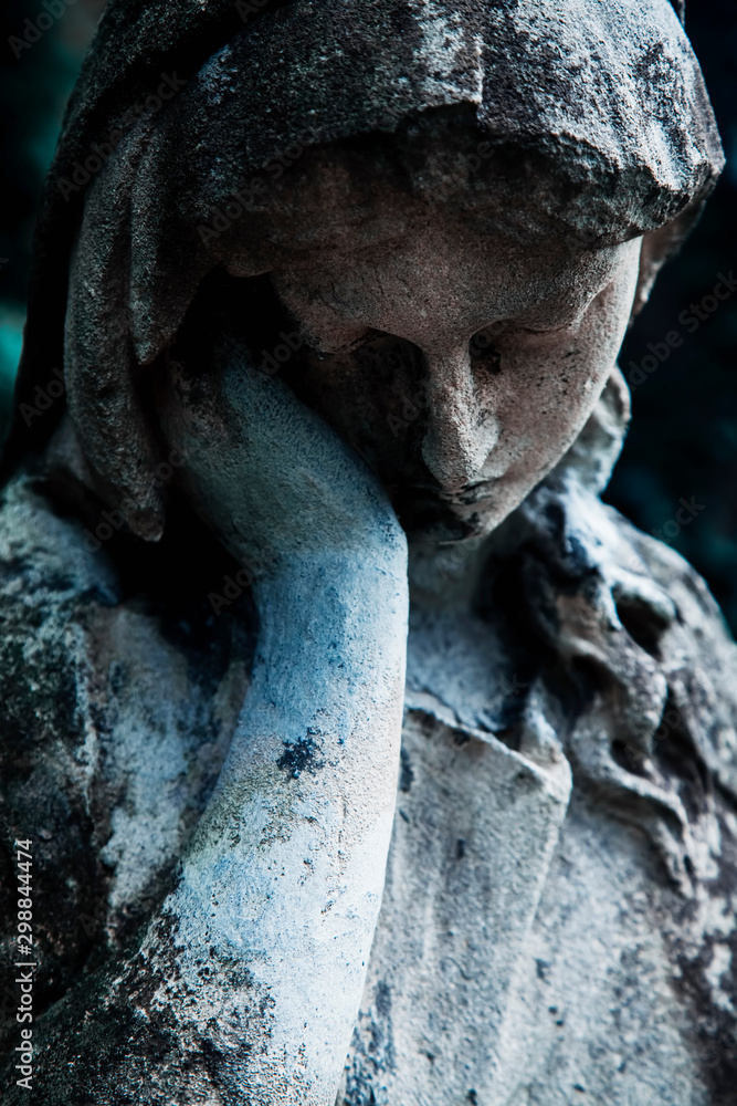 Ancient statue of woman on tomb as a symbol of depression, pain and ...