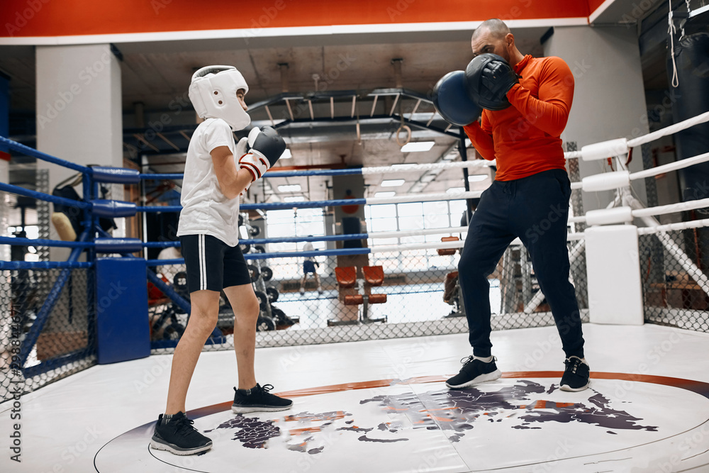 little boy attends boxing session, full length side view photo.boy ...