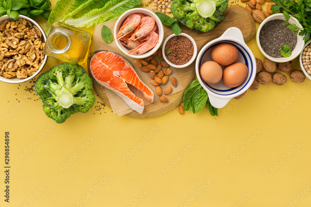 Poster Omega 3 food sources and omega 6 on yellow background top view ...