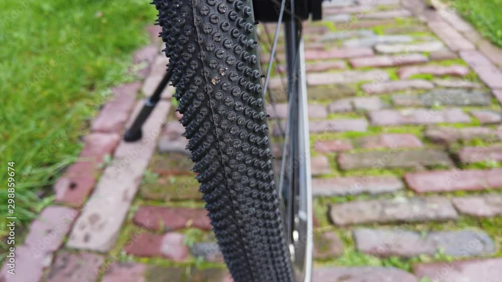 Close up footage of modern and brand new rear bicycle tire of parked ...