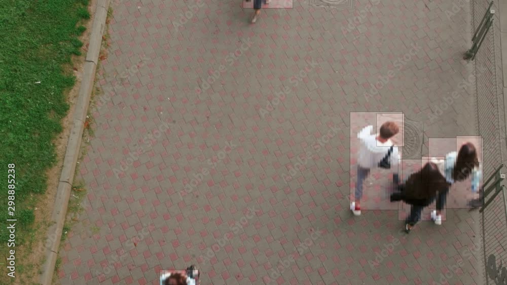 High view camera of people walking. Facial recognition interface scans ...