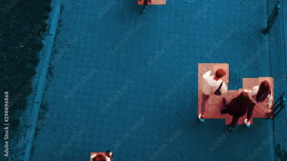 High view camera of people walking. Facial recognition interface scans ...