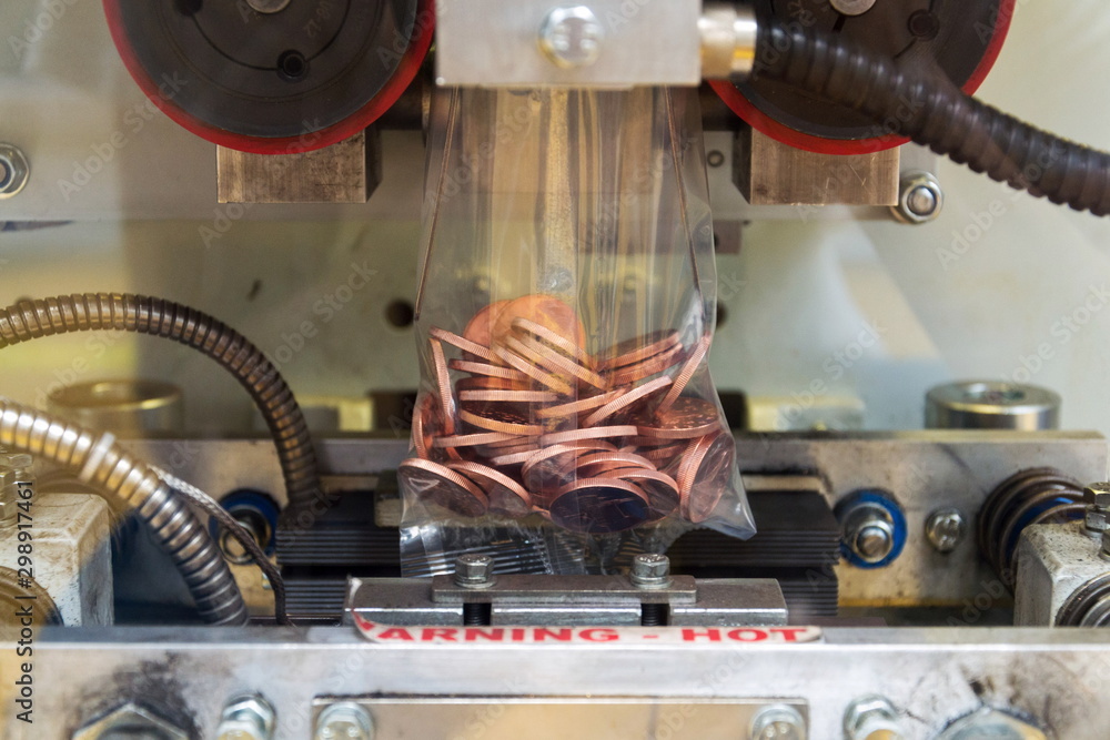 Coins manufactured and packed in money mint machine, steel galvanized ...