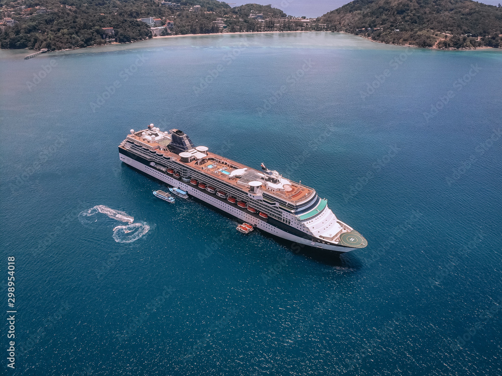 Bird eye view of the amazing white cruise ship sailing by the islands ...