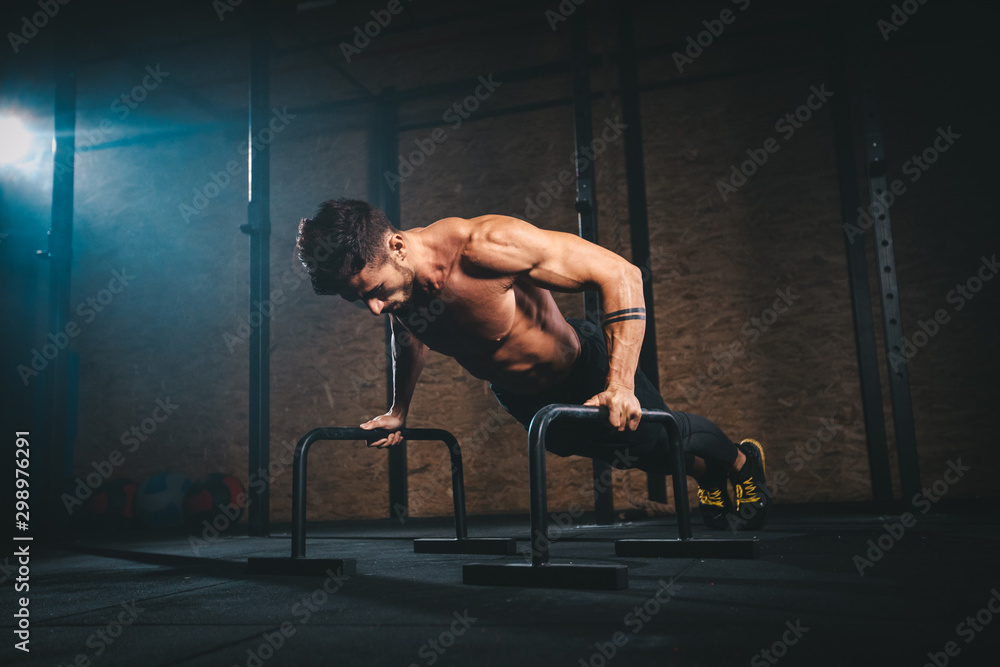 Hard training workout for a body guy in a cross fitness class complex ...