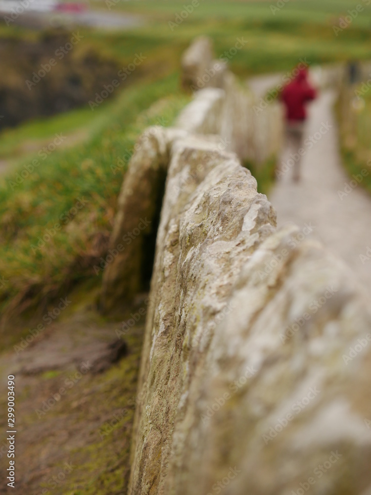 thin stone wall - cliffs of moher - blurry background Stock Photo ...