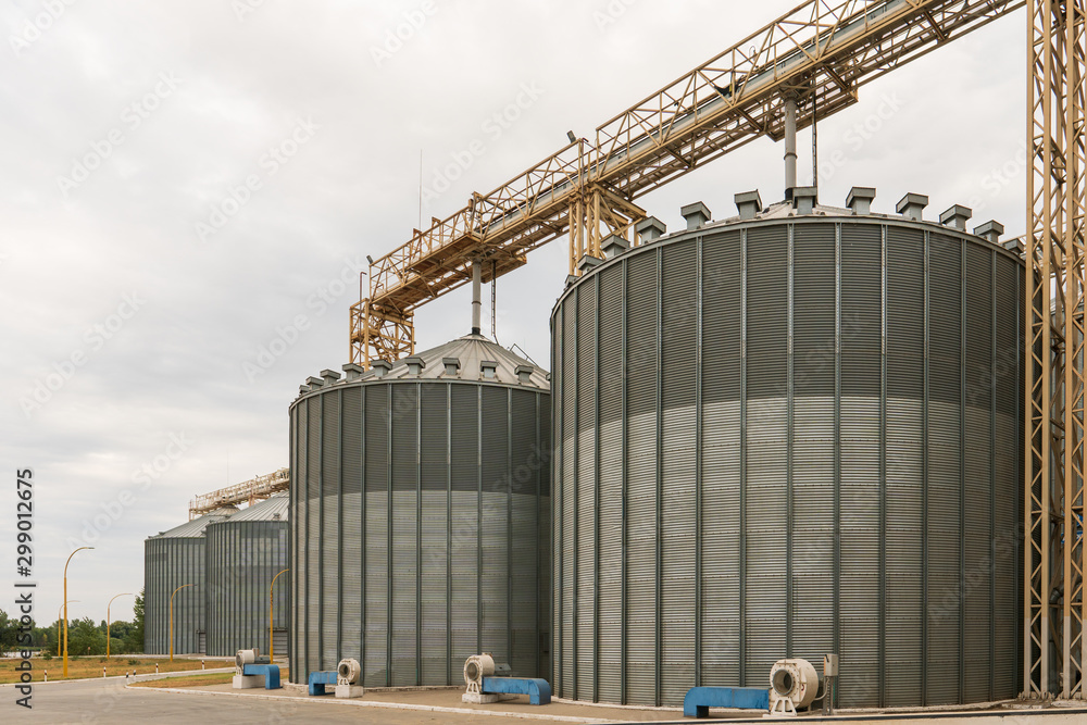 Modern elevator for storing grain against the sky. Grain drying complex ...