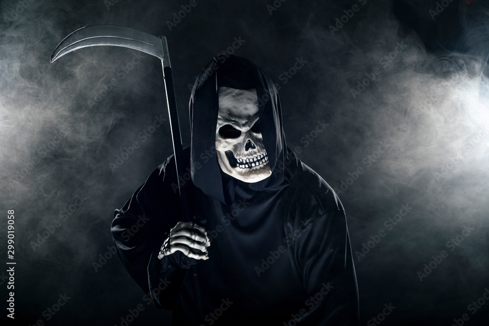 Scary looking grim reaper ghost wielding a scythe or sickle coming out ...