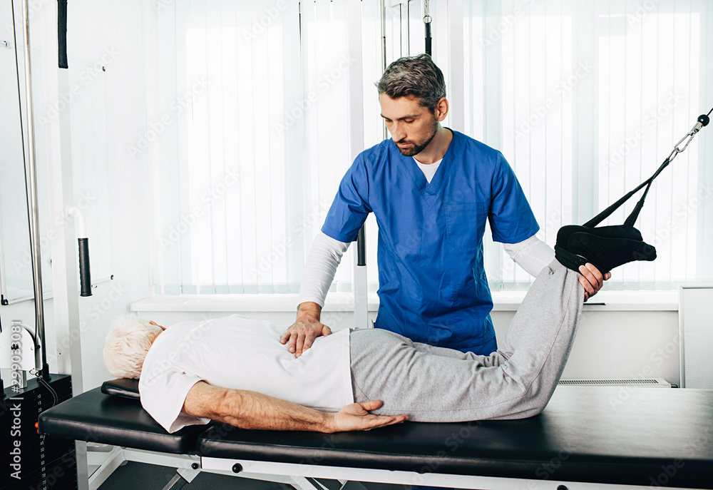 Senior patient recovery body during kinesitherapy. Treatment of pain in ...