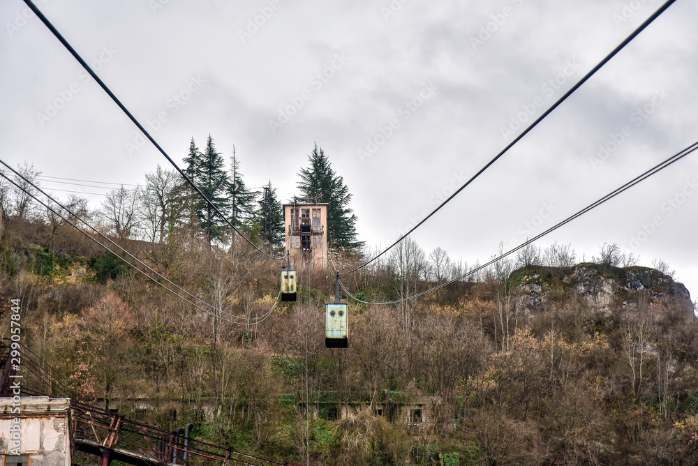 Old soviet rusty and functioning ropeway or cable car cabin on cable ...