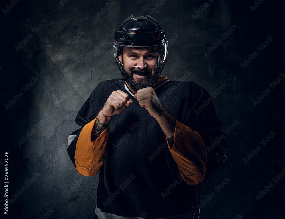 Toothless powerful hockey player in uniform is ready to fight, showing ...