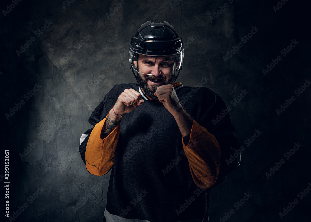 Toothless powerful hockey player in uniform is ready to fight, showing ...