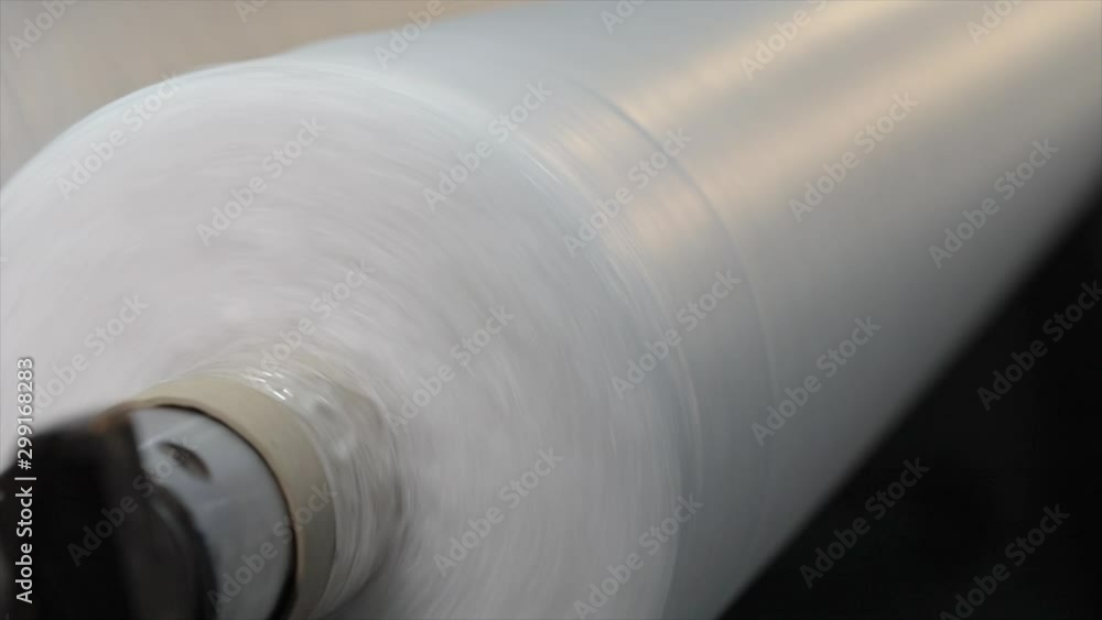 Pliester manufacturing process. Roll-up of non-woven fabric in a ...