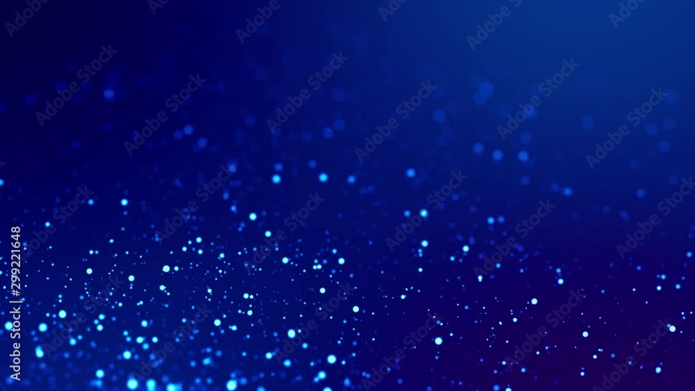glitter blue magic particles fly and glow in viscous liquid with ...