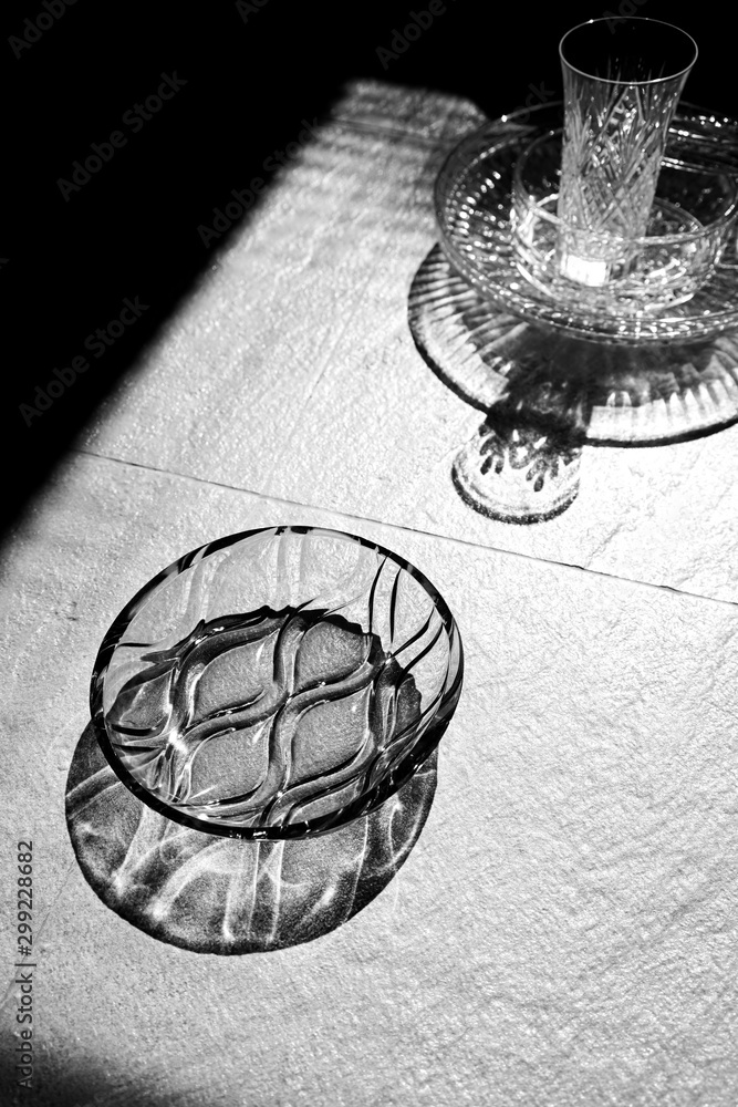 High contrast black and white crystal plates and glasses on white ...