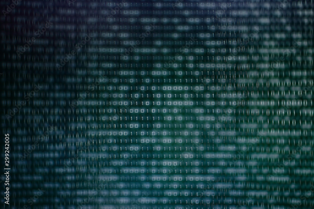 the most important data. binary code on computer screen. focused on text at the center, blurred ...