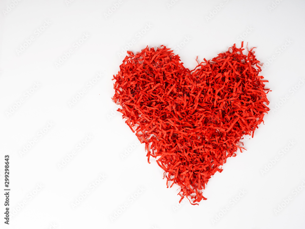 symbol of love or separation. heart of cut red paper, with crumbling ...