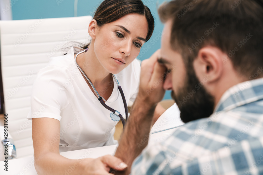 Doctor talking with her stressed sad patient Stock Photo | Adobe Stock