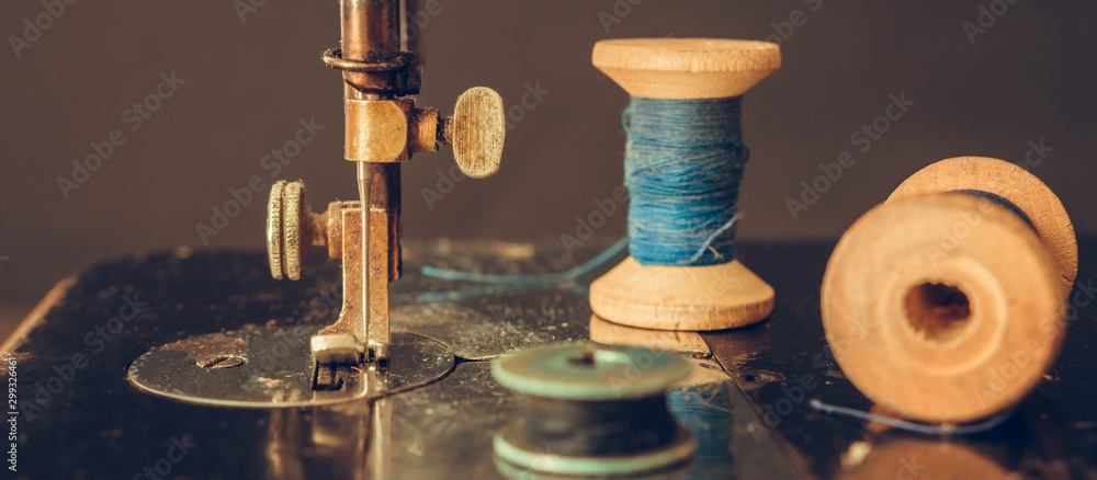 Old retro sewing machine and details of needle close-up of thread ...