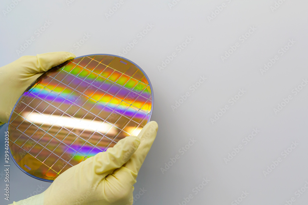 Silicon Wafer is held in the hands by gloves - A wafer is a thin slice ...
