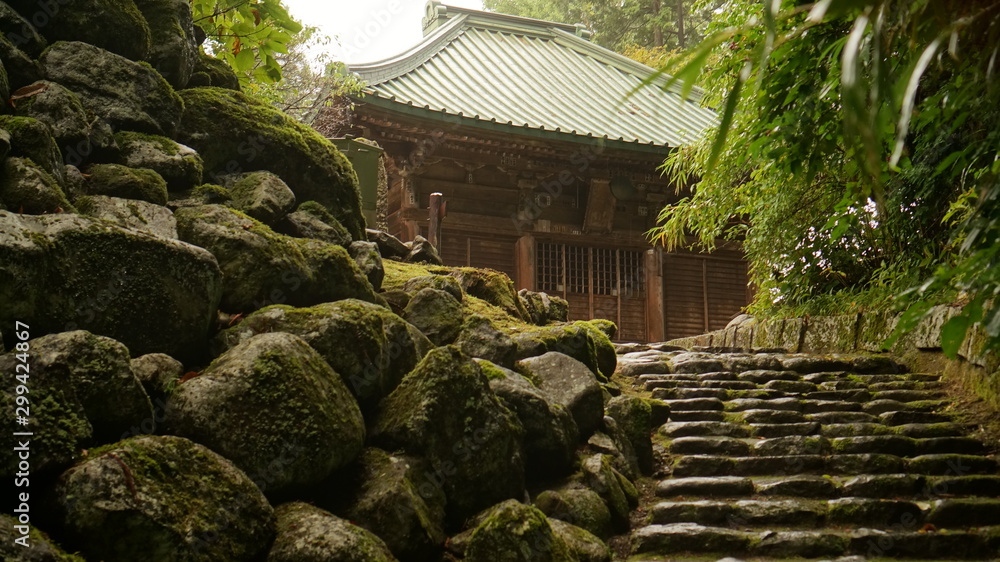 Old Japanese shrine in the forest during a rainy day in Nikko, Japan ...