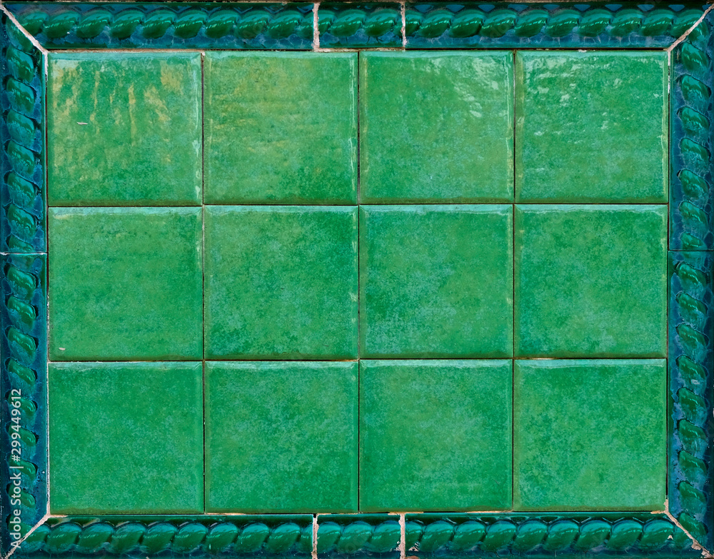 3x4 green glazed glossy tiles with floral dark frame, empty surface for ...