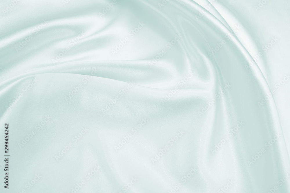 Delicate satin draped fabric of blue color texture for festive ...