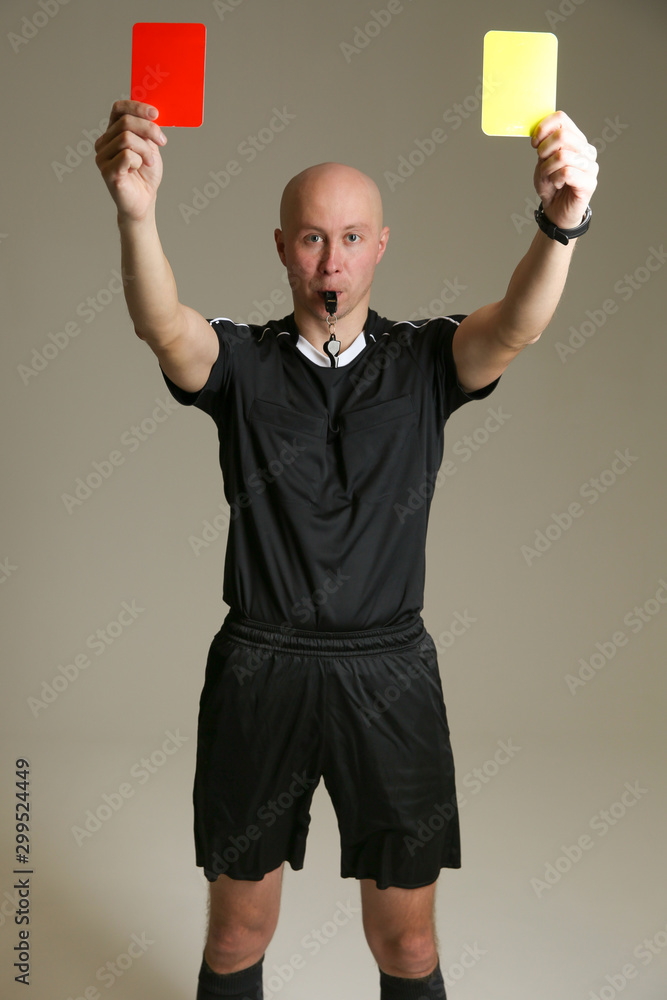 bald football referee on gray background. soccer referee raised both ...