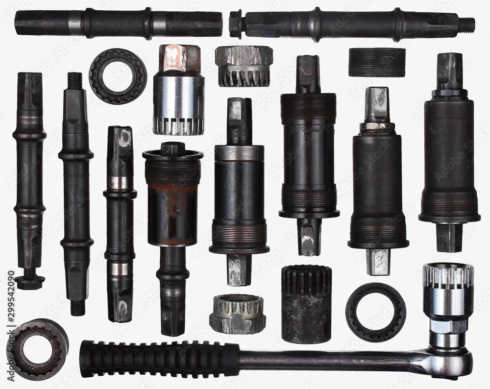 Old bicycle parts in bike workshop. Square-taper cartridge bottom ...