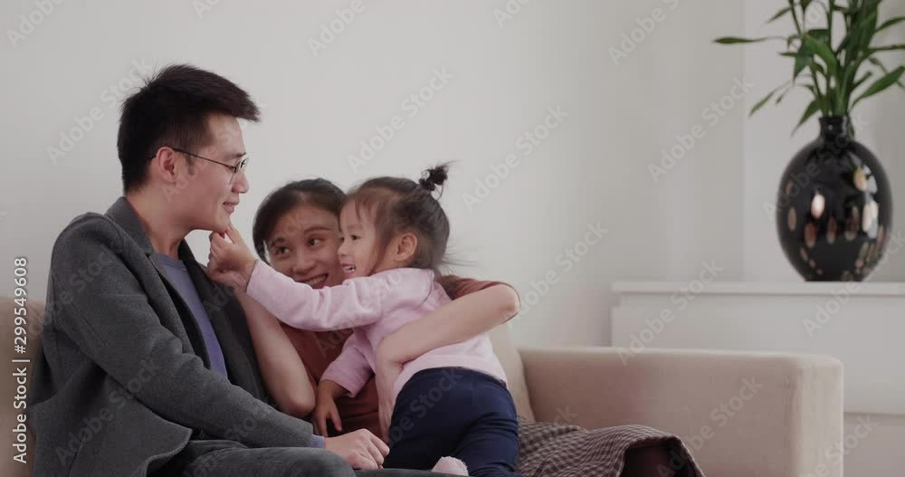 Mother and daughter playing with father happy asian family at home ...