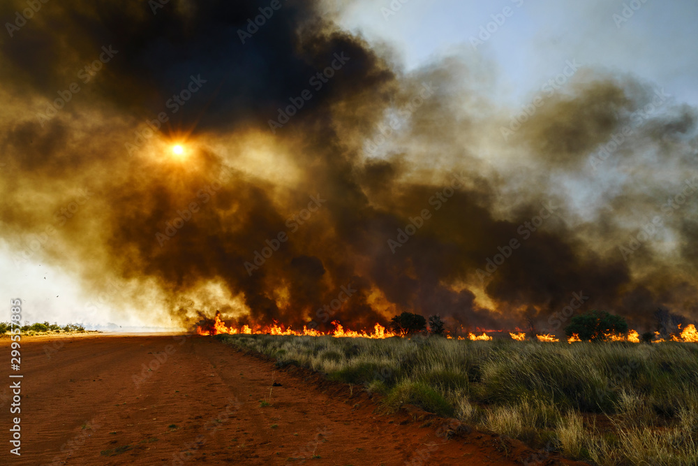 Bush fire in the Western Australian outback (Pilbara) with heavy, dark ...
