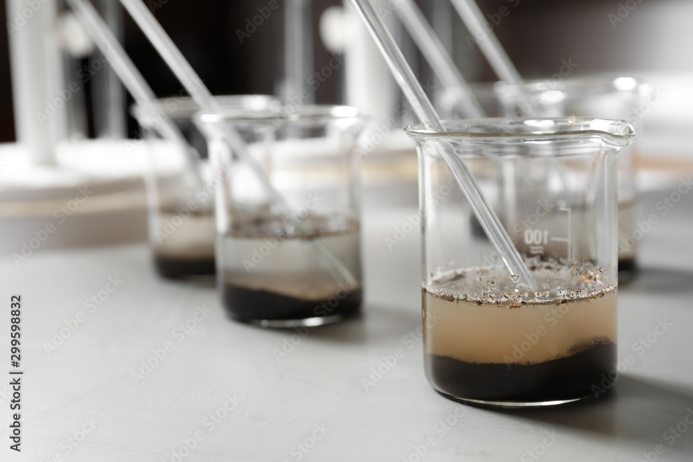 Beaker with soil extract on light table. Laboratory analysis Stock ...