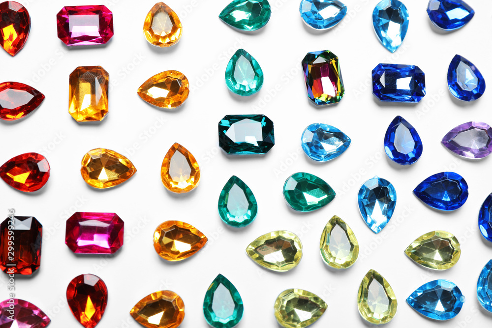 Different beautiful gemstones on white background, top view Stock Photo ...