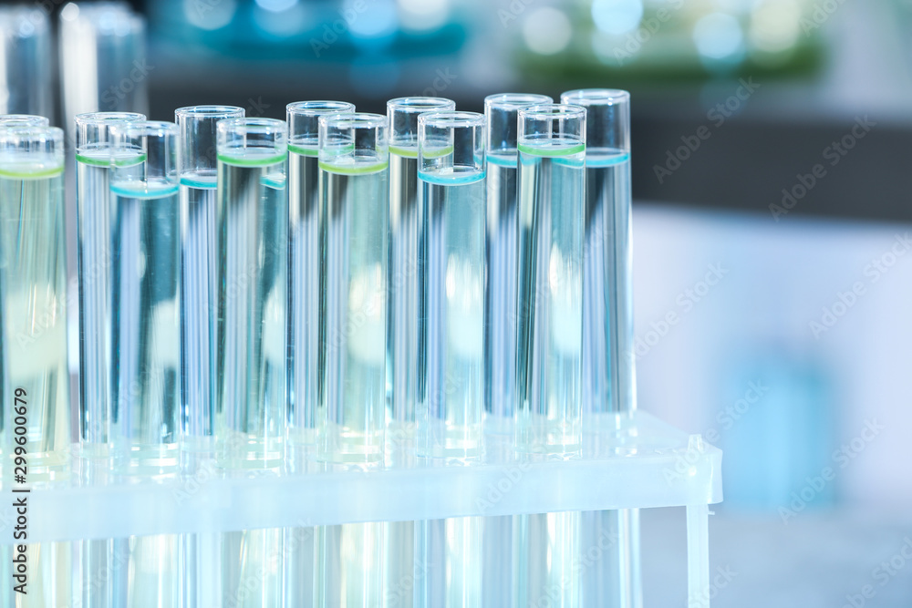 Test tubes with liquid samples for analysis in laboratory, closeup ...
