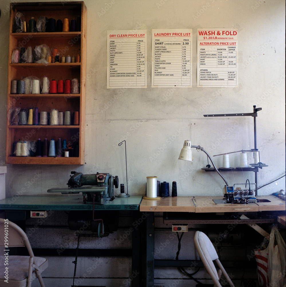 Tailor's workstations and price list in dry cleaning business Stock ...