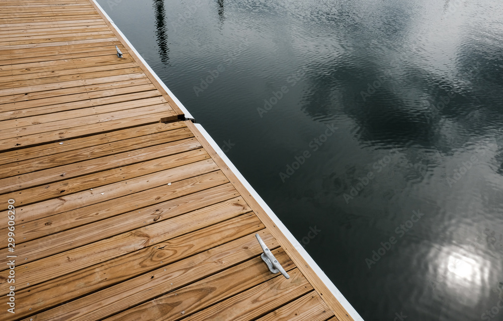 Newly installed timber built jetty seen on a harbour in a North ...