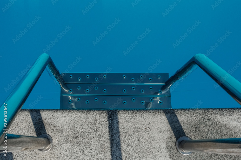 Ladder to the pool. Metal staircase. Pool. Ladder. Release to the pool ...