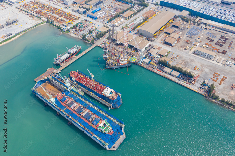 Aerial view of a jack up oil drilling rig and dry dock ship in the ...