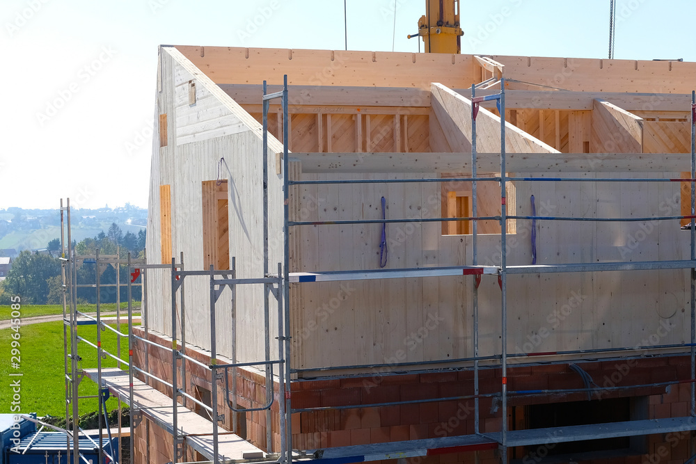 Framehouse with solid wooden walls is being built on bricks Stock Photo ...