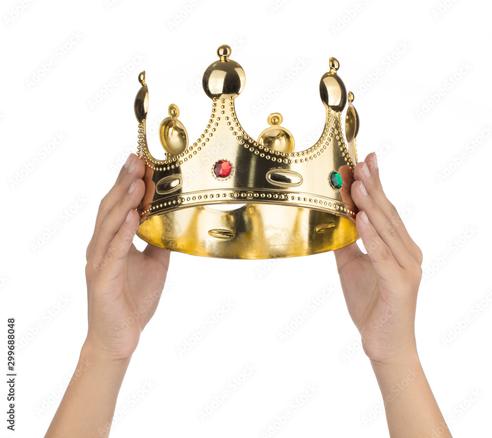 Hand holding Gold Crown with jewel isolated isolated on white ...