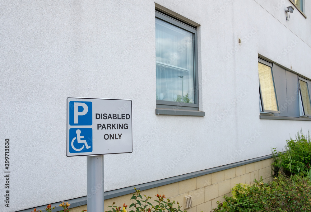Close-up view of a disabled vehicle parking sign seen located near the ...