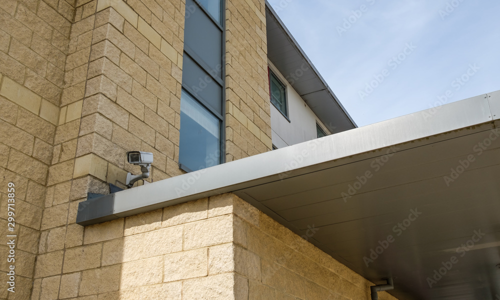 CCTV security camera seen pointing towards the entrance area of a well ...
